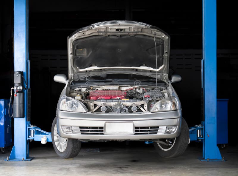 Car elevated in garage stock image. Image of care, tool - 43779945