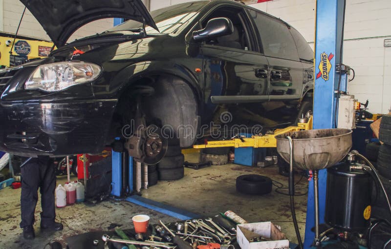 Car Under Repair in a Mechanical Workshop. Editorial Photo - Image of ...