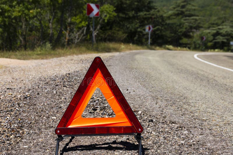 A Car Emergency Stop Sign is Installed on the Road. Danger on the Road ...