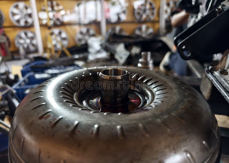 A Car Engine is Being Worked on Inside a Garage Workshop Stock Photo ...