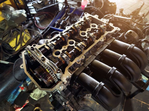 A Car Engine is Being Worked on Inside a Garage Workshop Stock Image ...