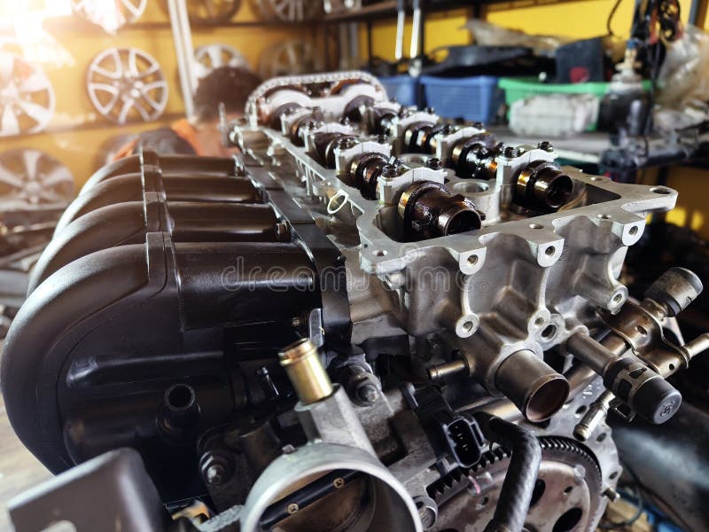 A Car Engine is Being Worked on Inside a Garage Workshop Stock Photo ...