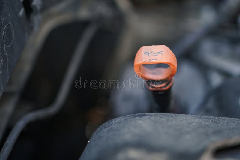 A Car Engine Oil Dipstick is Being Used To Check the Oil Level Stock ...