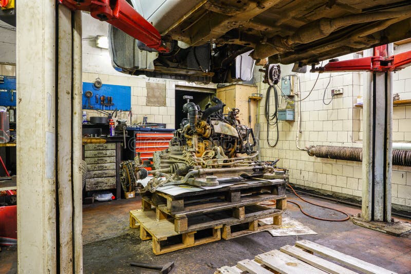 Car Engine Repair in Old Service, Removed Engine from Car Stock Photo ...