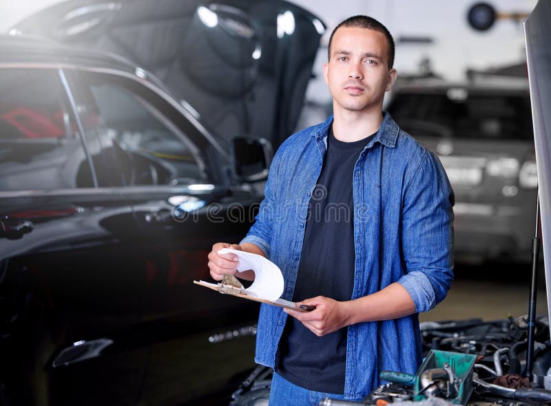 Car, Engineering and Mechanic with a Checklist at a Workshop or Garage ...