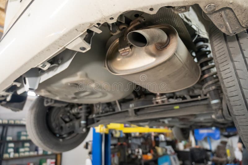 Car Exhaust Pipe in Garage. Stock Photo - Image of closeup, steel ...