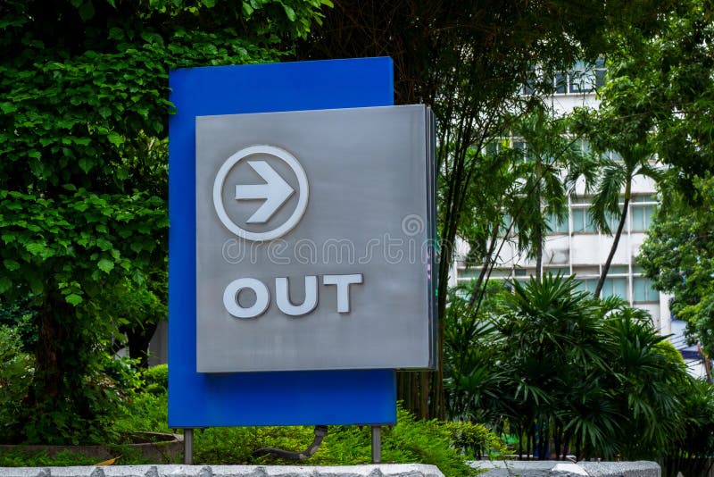 Car Exit Sign with a Green Garden S Trees in the the Background Stock ...