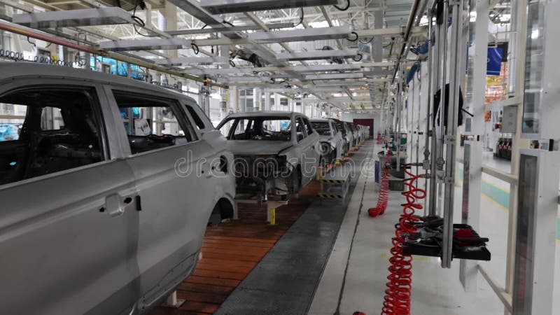 Car Factory, Unpainted Car Bodies on Conveyor Stock Video - Video of ...