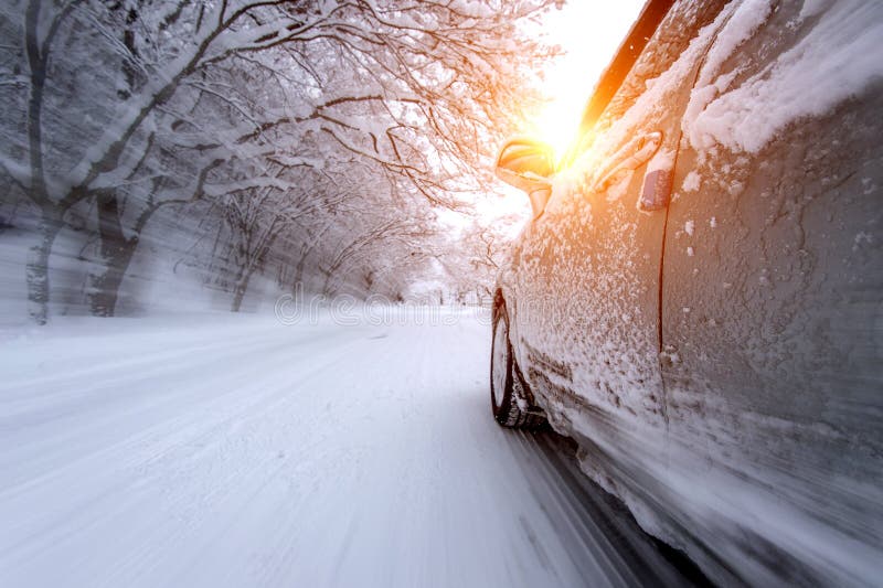 Car and Falling Snow in Winter on Forest Road with Much Snow. Stock ...