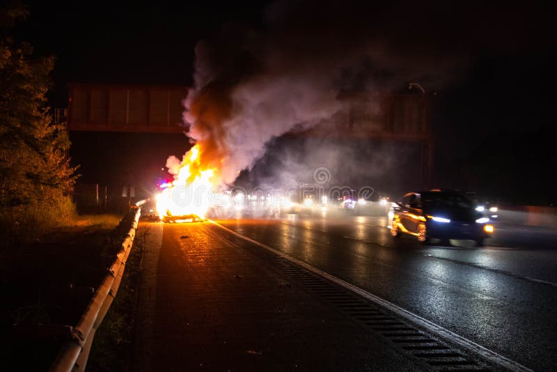 Car on Fire at Night with Police Lights in Background Stock Photo ...