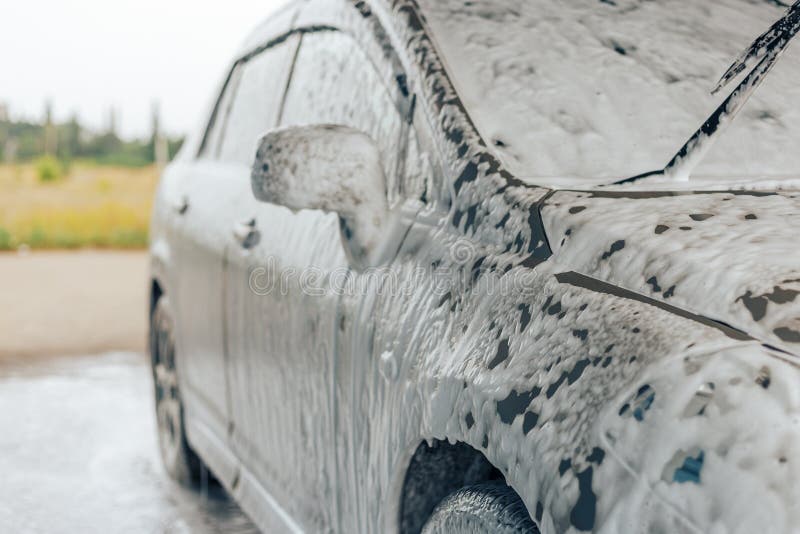 Car in foam on car wash stock photo. Image of automobile - 98189054