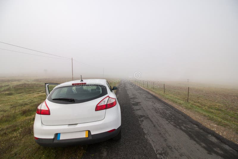 Car in the fog stock photo. Image of vehicle, lost, morning - 105998060