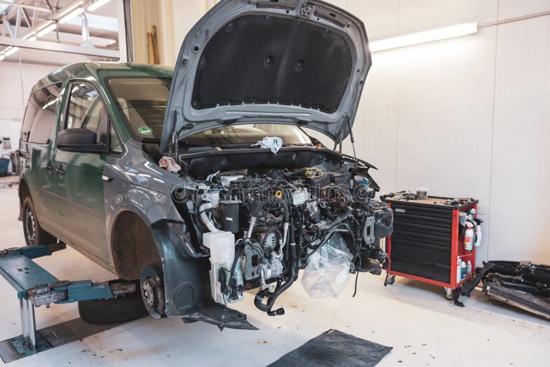 A Car without the Front and without the Hood is Standing in a Garage ...