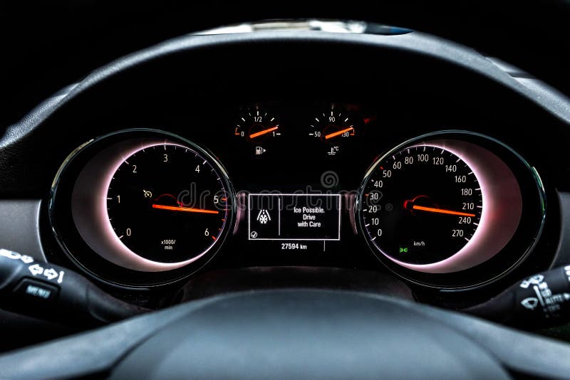 Car Front Instrument Panel with Warning of Slippery Roads. Stock Photo ...