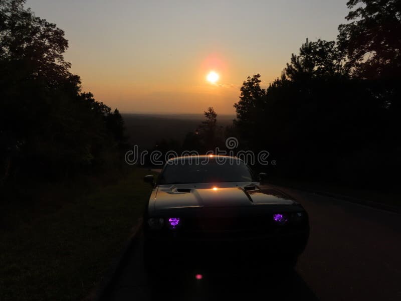 Car in front of a sunset stock image. Image of challenger - 155395383