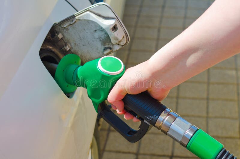 Car fuelling stock image. Image of closeup, sunny, nozzle - 22668589