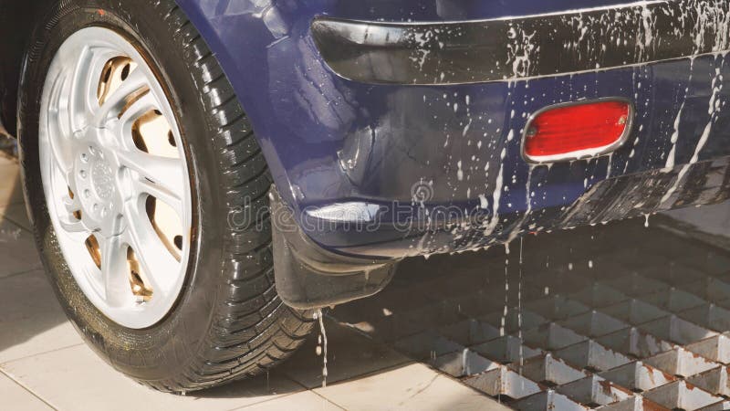 Car Getting Washed, Soap Dripping from the Bumper Stock Photo - Image ...