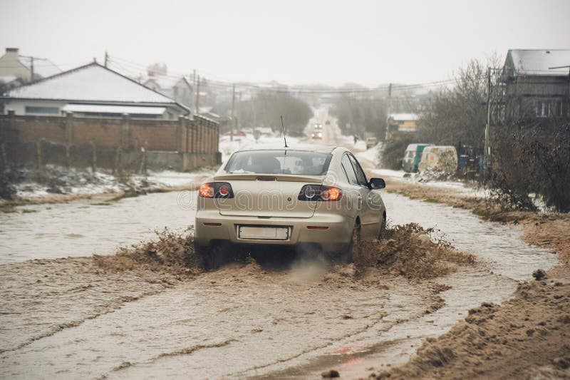 Car Goes by Broken Dirty Road. Bad Roads Condition Problem Concept ...