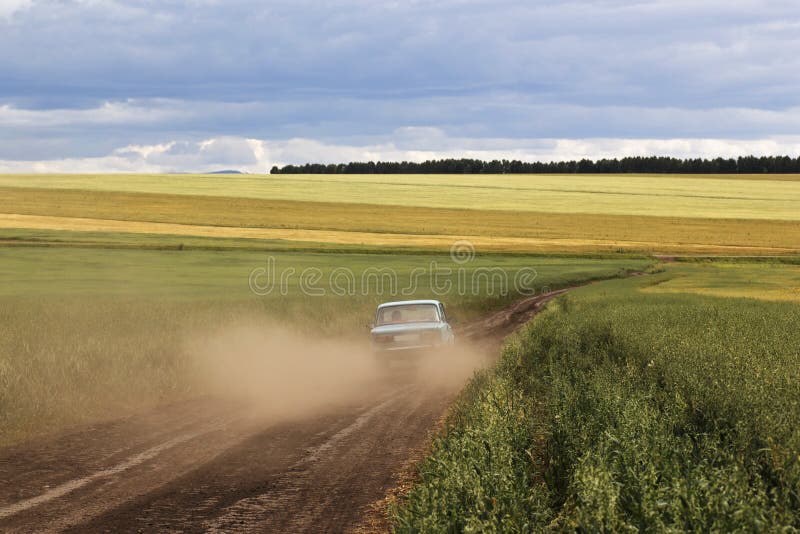 Car on Ground Road in the Fields Stock Photo - Image of blue, land ...