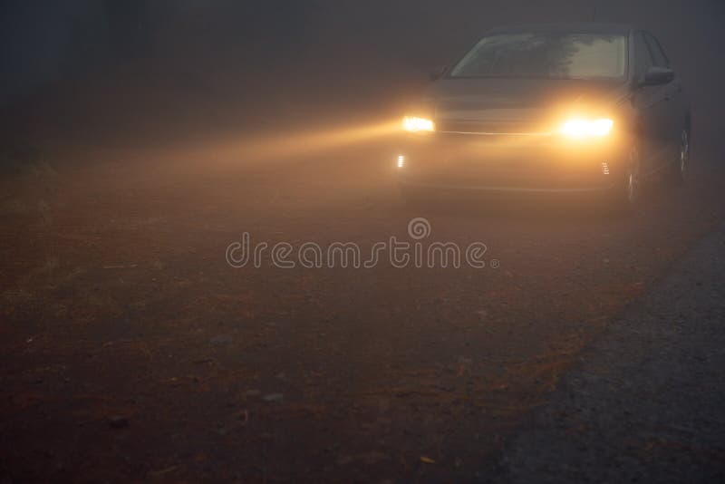 Car Headlight Beams in Dense Mist Stock Photo - Image of lamp, orange ...