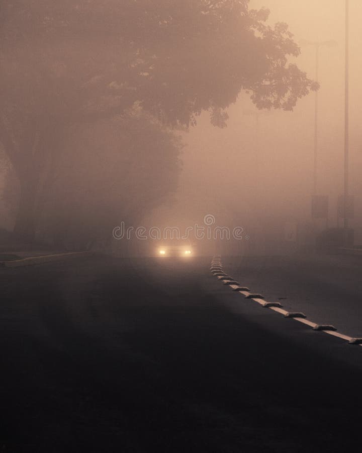 Headlights through the Mist of Evening, the Winter Stock Photo - Image ...