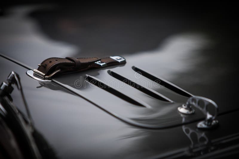 Car hood and leather strap stock photo. Image of shiny - 174657908