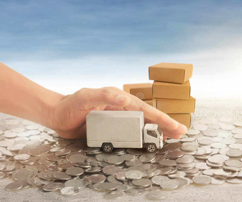 Car and House Model with Stack of a Coins in Hand Stock Image - Image ...