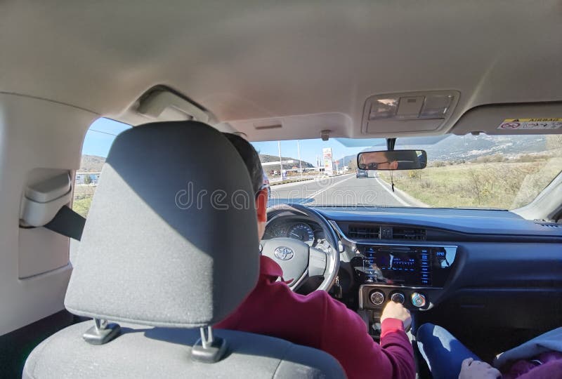 Car Inside View from Back Seat while Driver Driving Stock Photo - Image ...