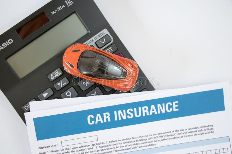 Car Insurance Concept with Car Insurance Form, Toy Car and Calculator ...