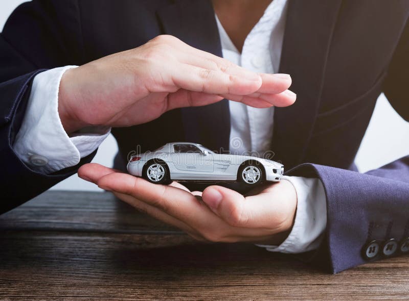 Car Insurance Concept, Hand Man Protect a Car on the Table. Stock Image ...