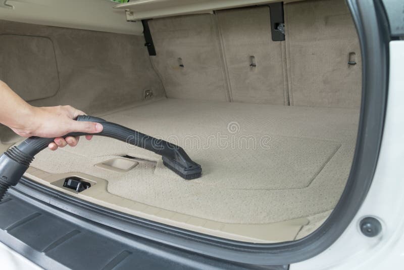 Car Interior Detailing Vacuuming Dust from a Car Carpet in the Boot ...
