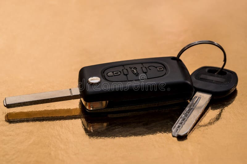 Car key isolated on gold. stock photo. Image of gold - 130704678