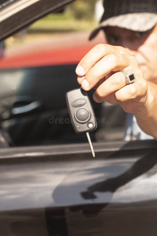 Car Key in a Man& X27;s Hand with Car. Stock Image - Image of ring ...