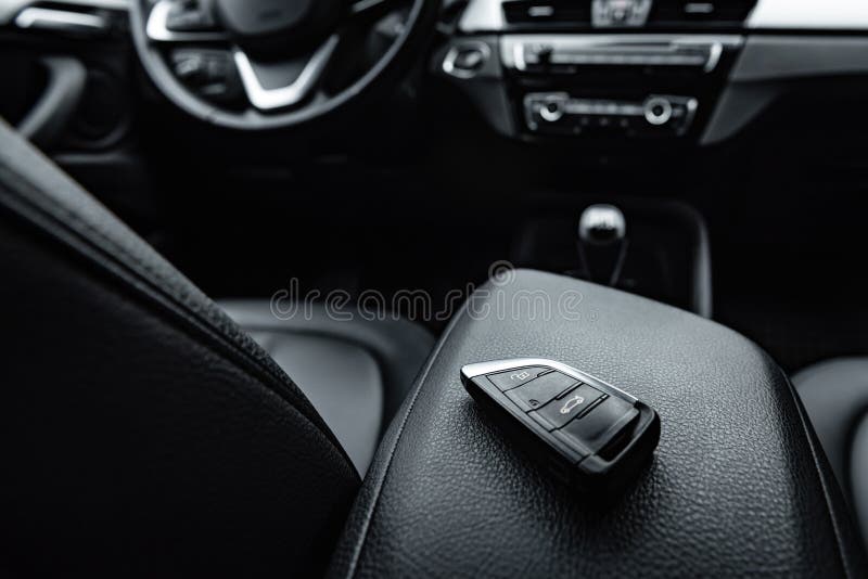 Car Key Remote in Black Leather Interior. Start Engine Key. Stock Photo ...