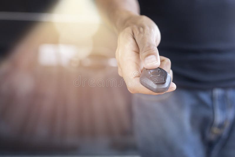 Car Key Remote on Hand. Hand Man Giving a Car Key Stock Photo - Image ...