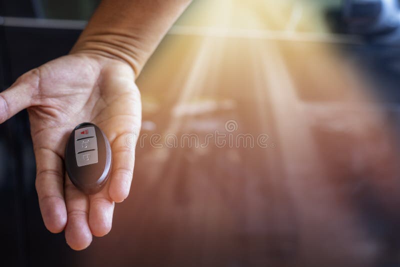 Car Key Remote on Hand. Hand Man Giving a Car Remote Stock Image ...
