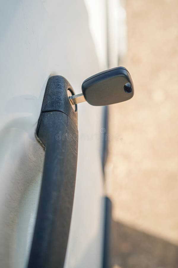 A Car Key is Stuck in the Door Handle Stock Image - Image of silver ...