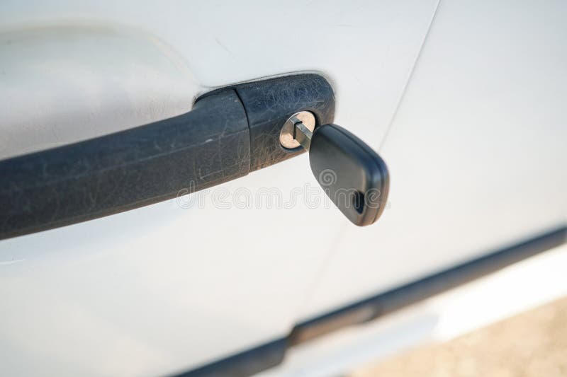A Car Key is Stuck in the Door Handle Stock Photo - Image of doorknob ...