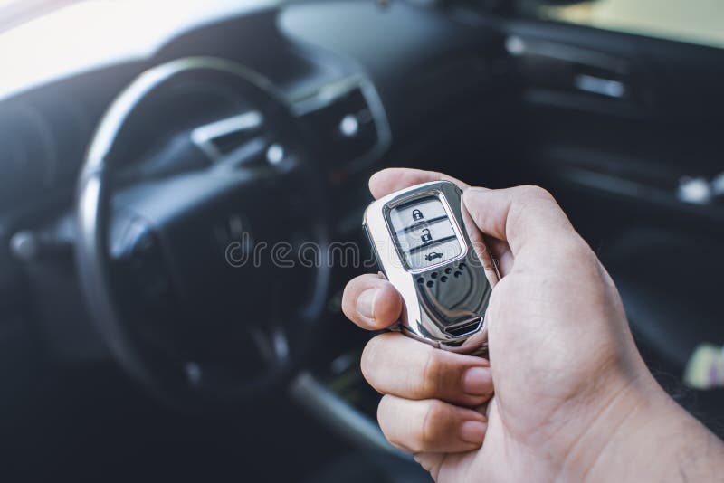 Car Keyless Entry Remote in a Hand Stock Image - Image of closeup ...