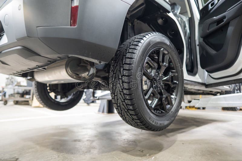 Car on a Lift during Tire Change. Stock Image - Image of problem ...