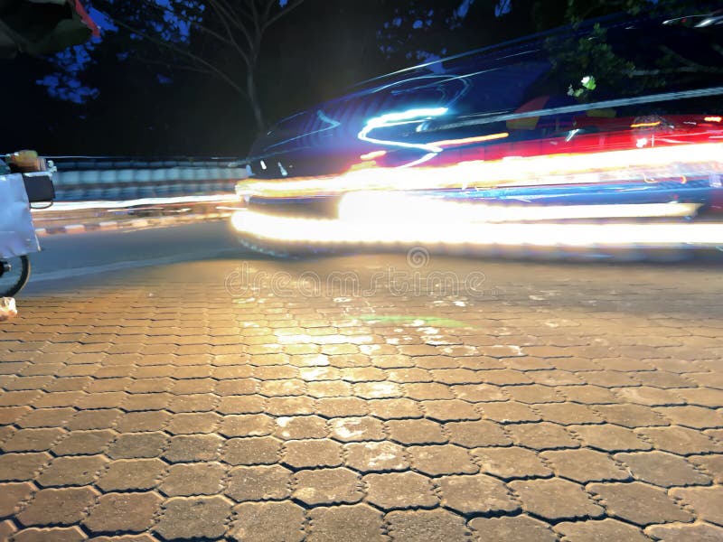 Car light at night passing stock photo. Image of speed - 257576420