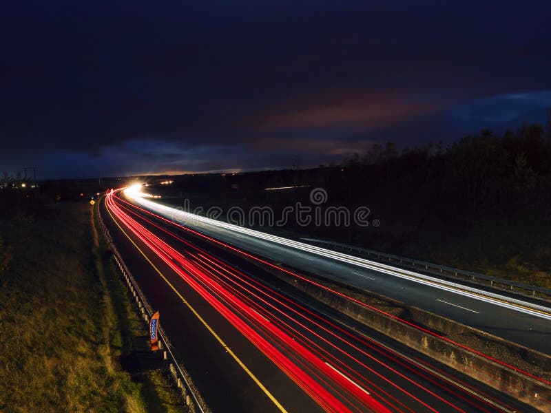 Car Light Trail on a Free Way in Two Directions. Dark Blue Sky Stock ...