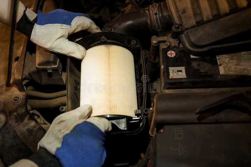 Car Maintenance: Changing the Air Filter in an Automobile Engine ...