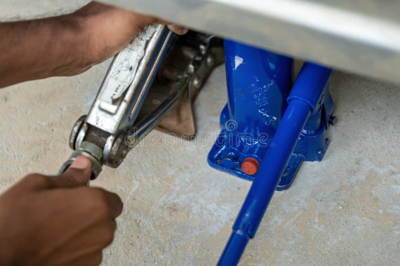 Car Maintenance Lifting with Jacks Stock Photo - Image of personal ...