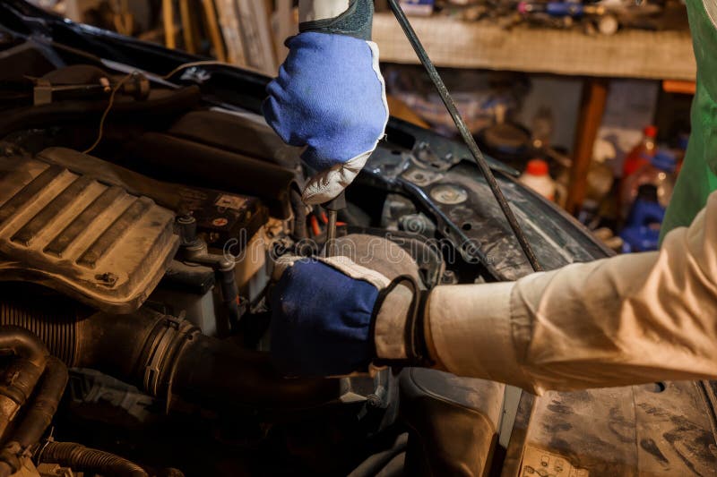 Car Maintenance Technician Working Under the Hood Stock Image - Image ...