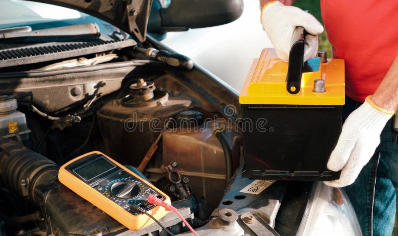 Car Maintenance before Winter. an Auto Mechanic is Changing the Car ...