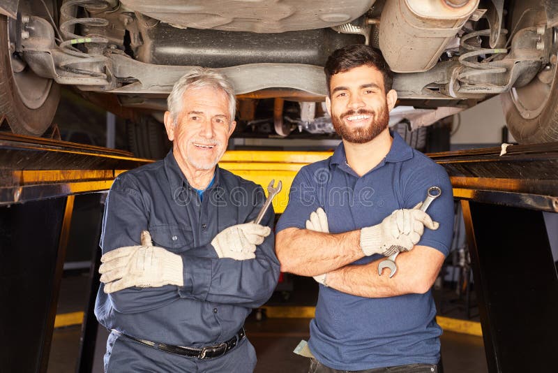 Car Master and Mechatronic Apprentice in Front of Car Stock Photo ...