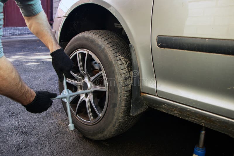 Car Mechanic Changing Wheels in Car Stock Image - Image of shop ...