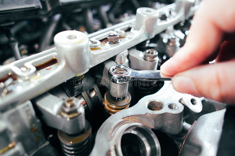 Car Mechanic Checking and Adjusting Valves of Car Engine Stock Image ...