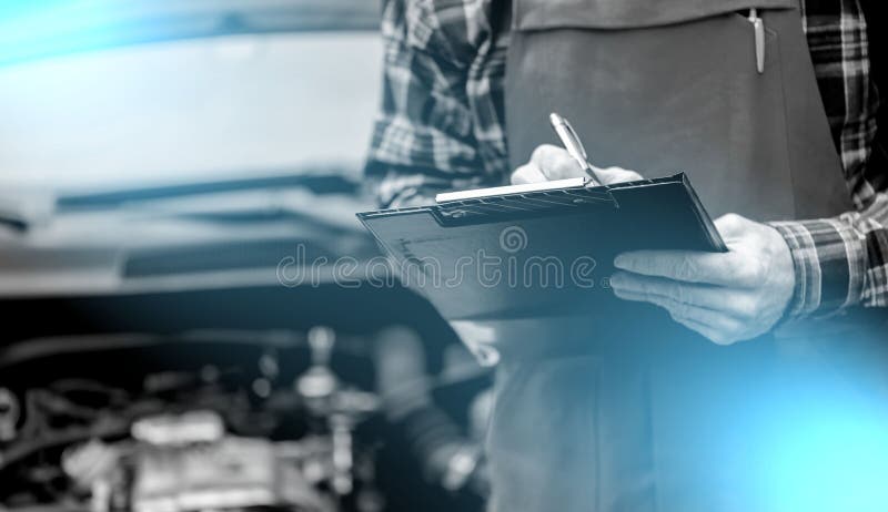 Car Mechanic Checking a Car Engine; Light Effect Stock Image - Image of ...